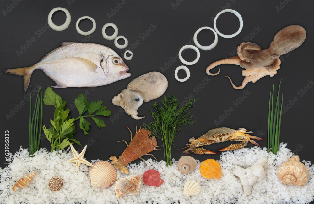 Cooking seafood concept. Vegetables and salt as sea bottom with fish ...