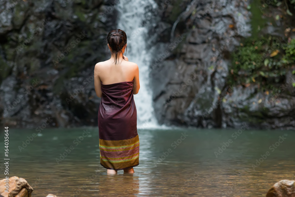 Daily life of rural women in Asia,Was bathing in a waterfall Stock ...