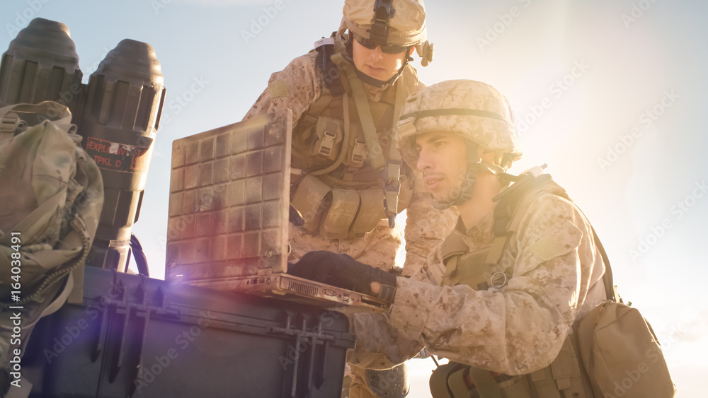 Close-up shot of Soldier is Using Laptop Computer for Surveillance ...