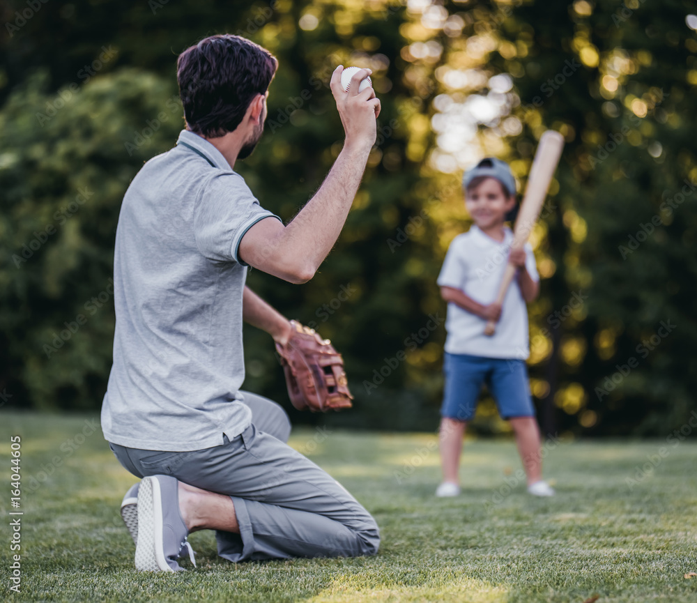 Dad with son playing baseball Stock Photo | Adobe Stock
