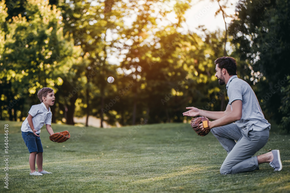 Dad with son playing baseball Stock Photo | Adobe Stock
