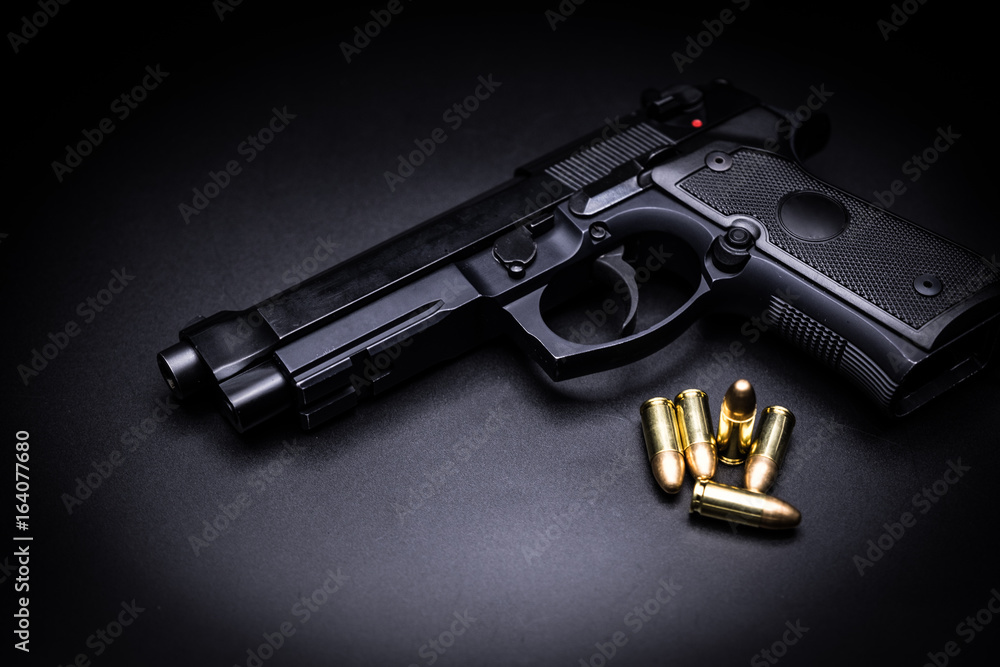9mm pistol gun on black background Stock Photo | Adobe Stock
