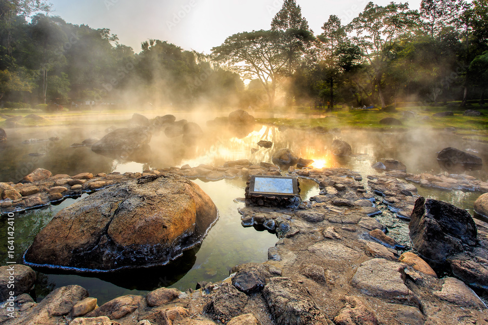 Mineral hot water in hot springs and morning fog background at Chae Son ...
