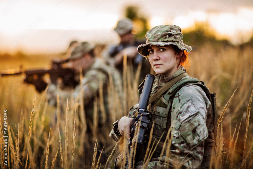 Rangers shooting with his weapon, rifle at sunset. War, army, military ...