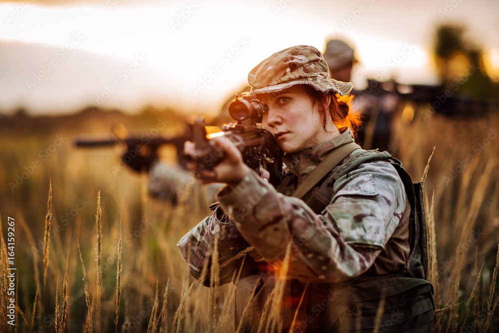 Rangers shooting with his weapon, rifle at sunset. War, army, military ...
