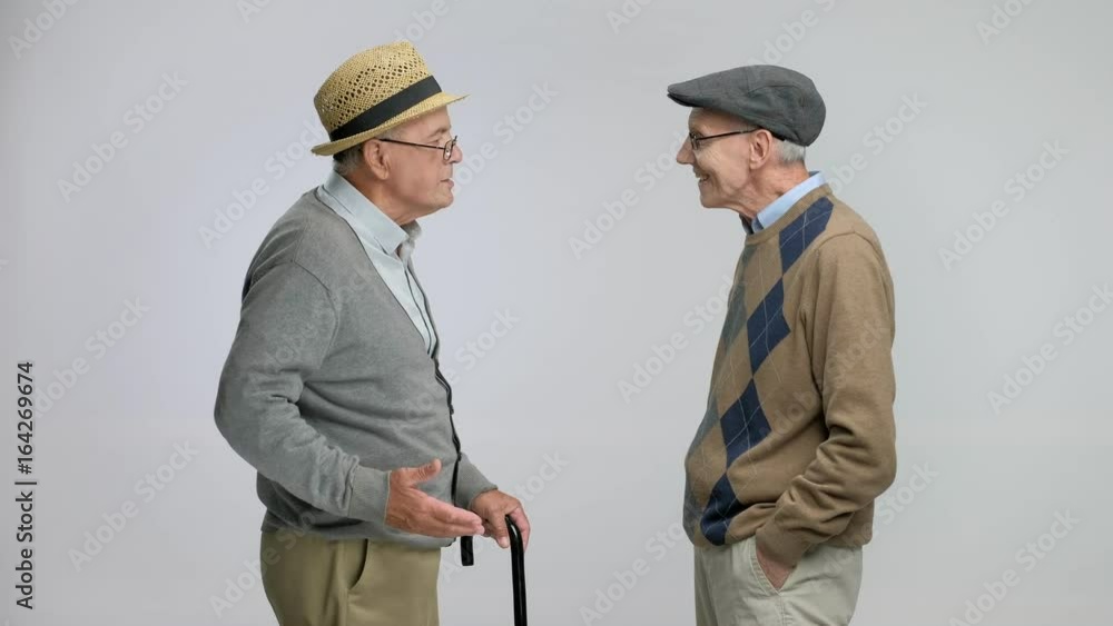 Two elderly men talking and high fiving each other Stock Video | Adobe ...