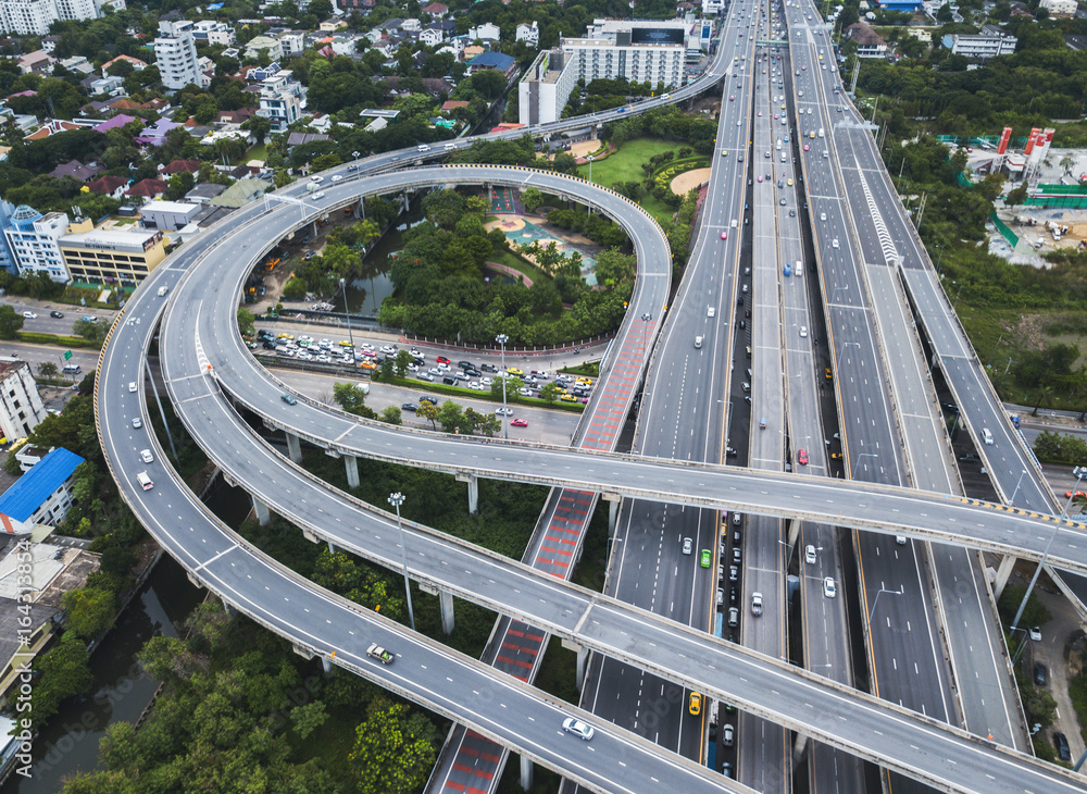 Aerial view from the drone on the highway of freeway and downtown with ...