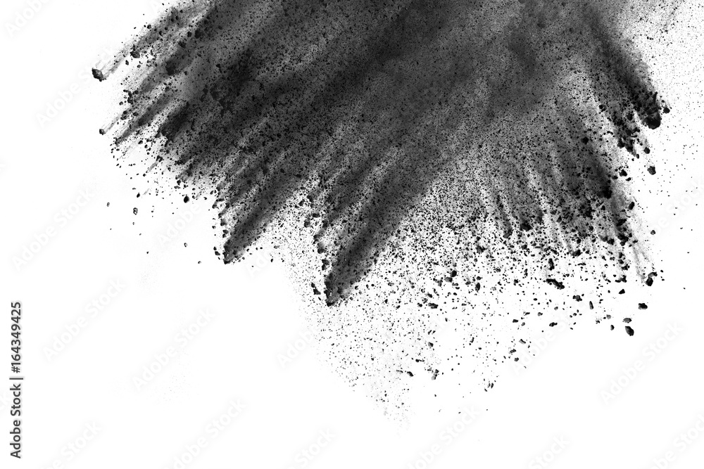 Black powder explosion. Closeup of black dust particles explode ...