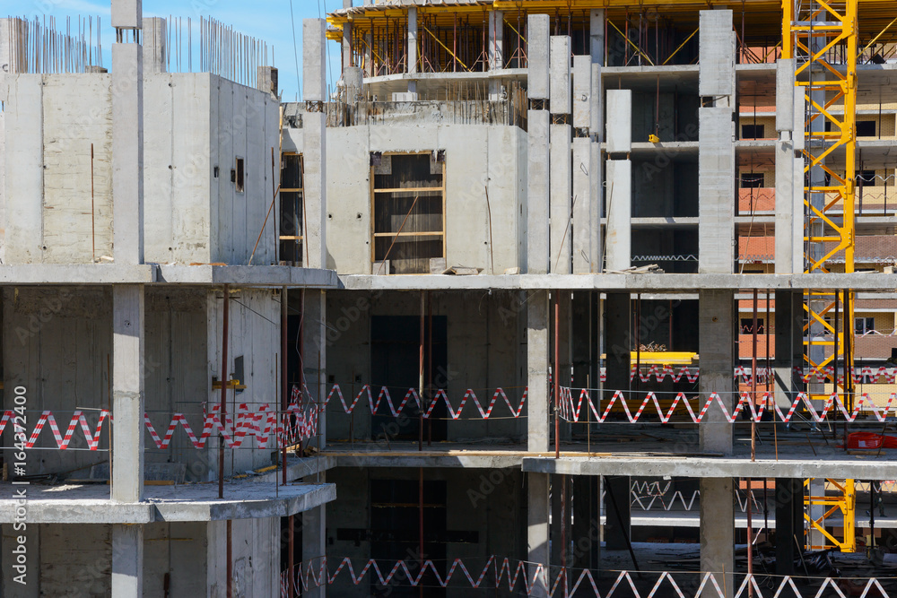 The frame of a multifamily high-rise residential building during ...