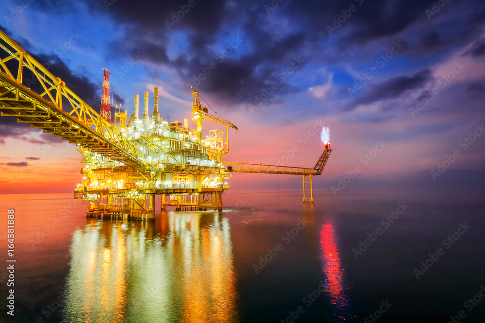 Offshore oil and rig platform in sunset or sunrise time. Construction ...