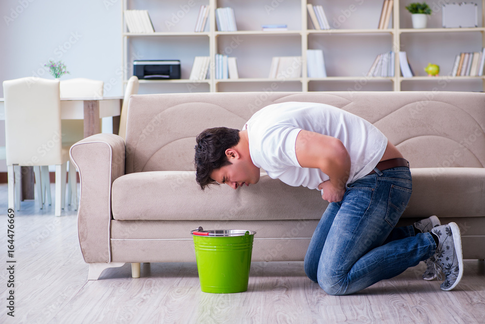 Man suffering from sick stomach and vomiting Stock Photo | Adobe Stock