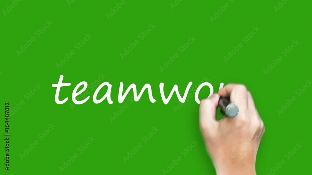 Teamwork - Writing with marker on green screen - Business concept ...