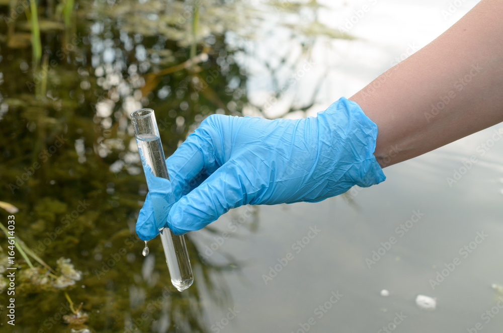 Taking a water test for analysis from a reservoir. Stock Photo | Adobe ...