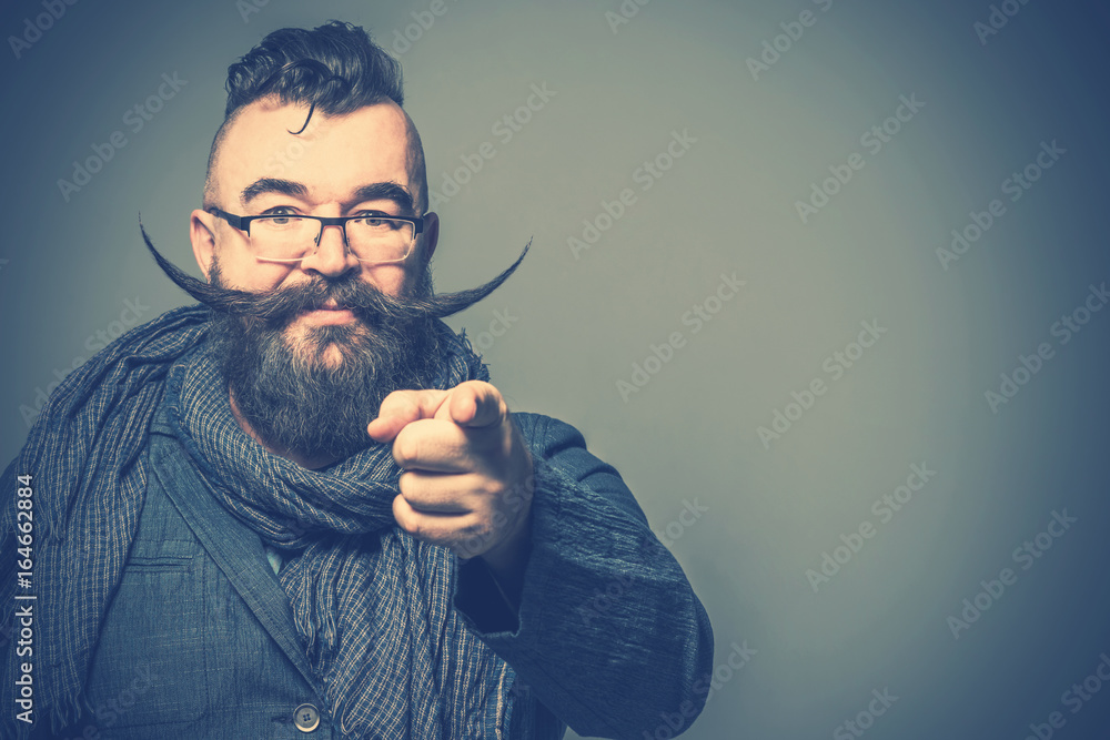 Poster Adult bearded man with a mohawk hairstyle and with a very long ...