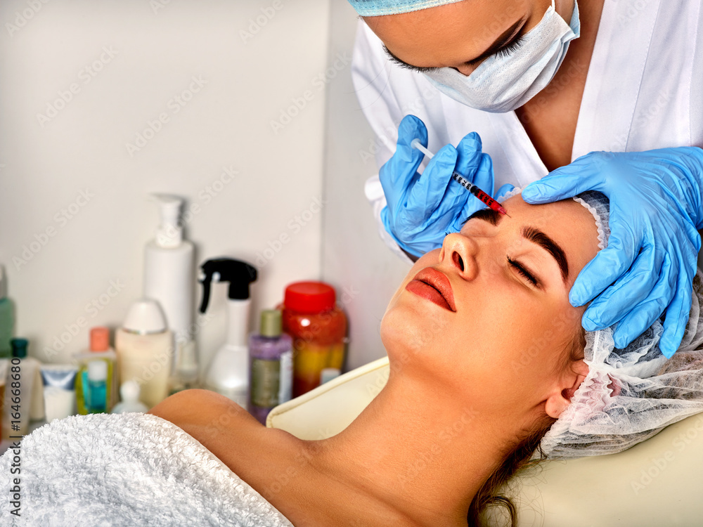 Filler injection for female forehead face. Plastic aesthetic facial ...
