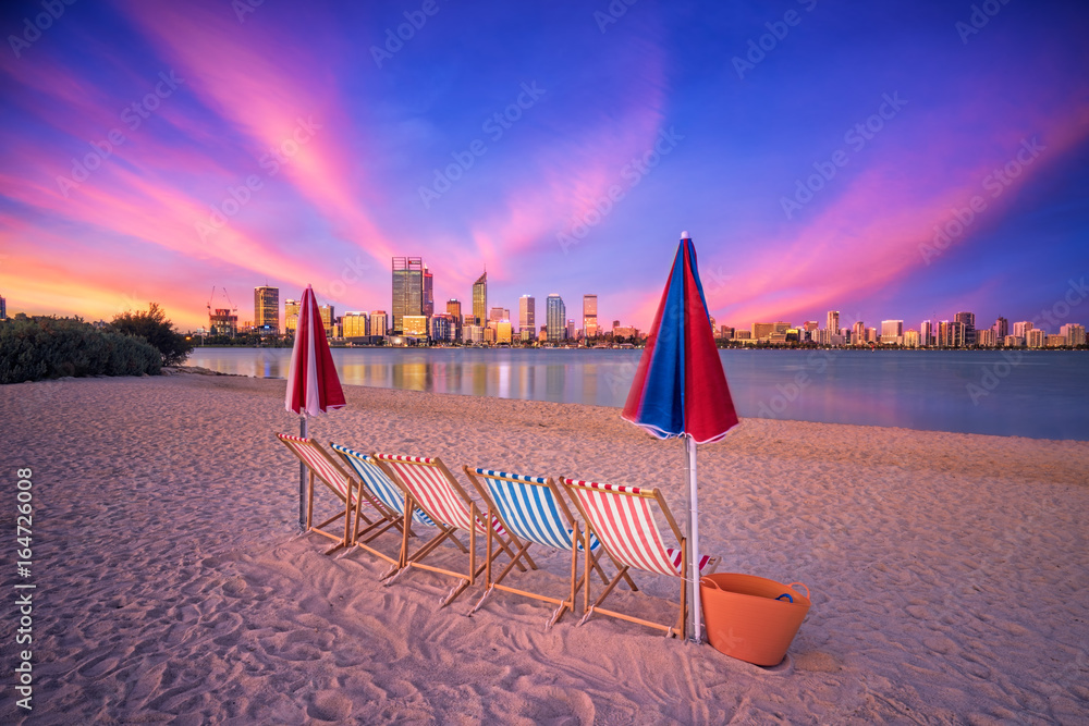 Deck chairs on a beach overlooking Perth City, Western Australia Stock ...
