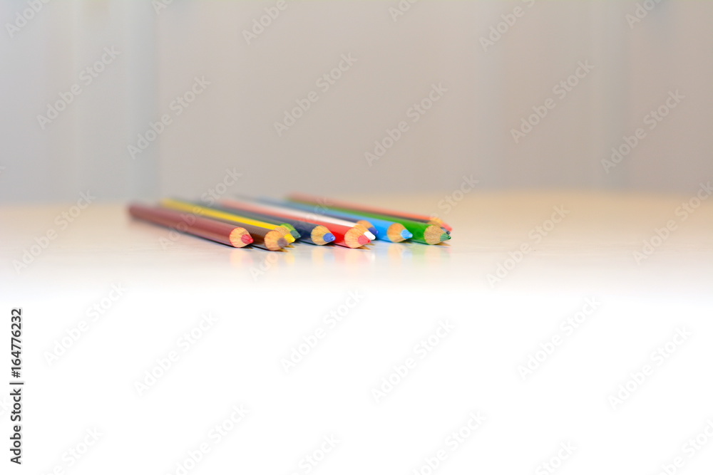 Different colored pencils stacked next to each other portraying ...