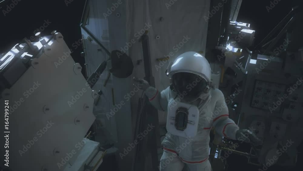 An astronaut on a spacewalk at the International Space Station. Highly ...