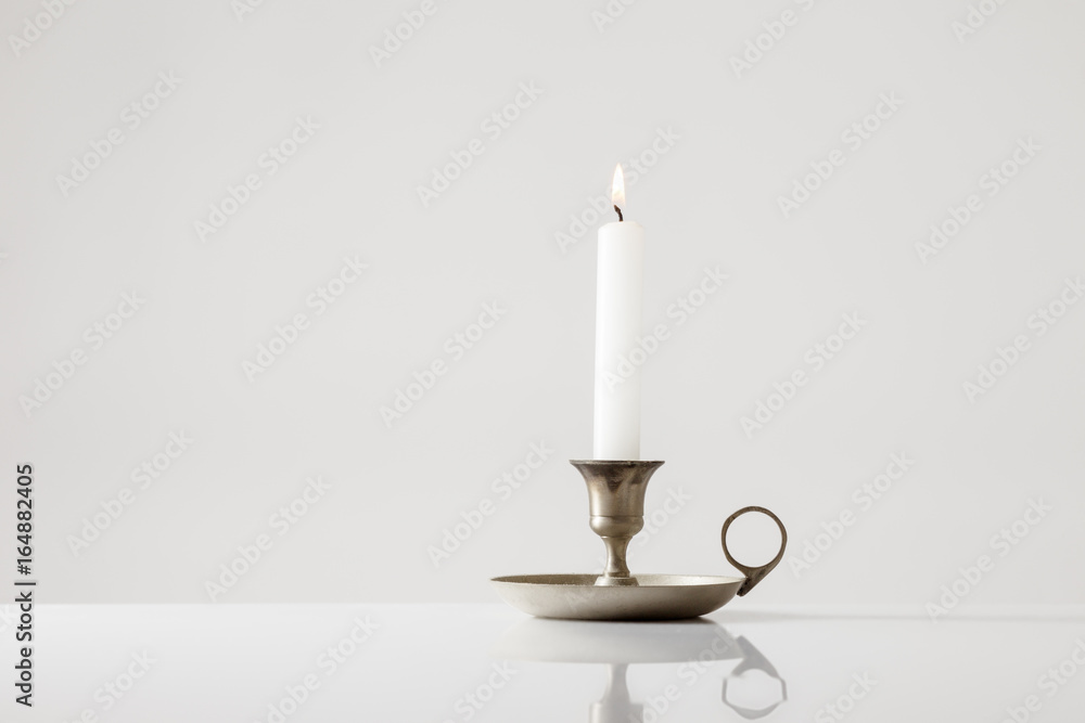 Candle burning bright Stock Photo | Adobe Stock