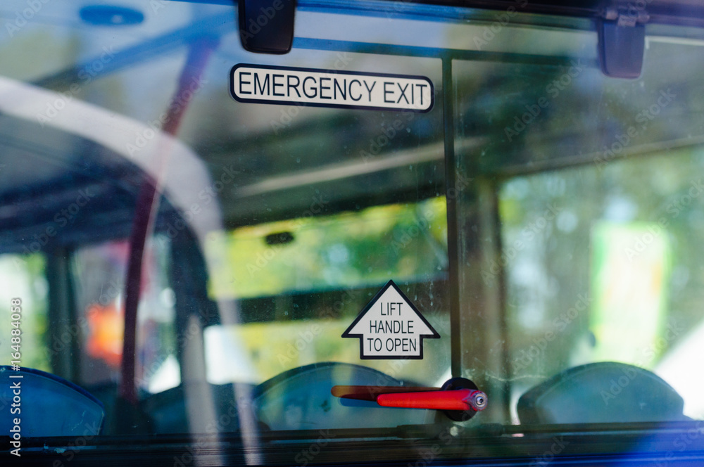 Fotka „Handle on the emergency exit rear window of a double decker bus ...
