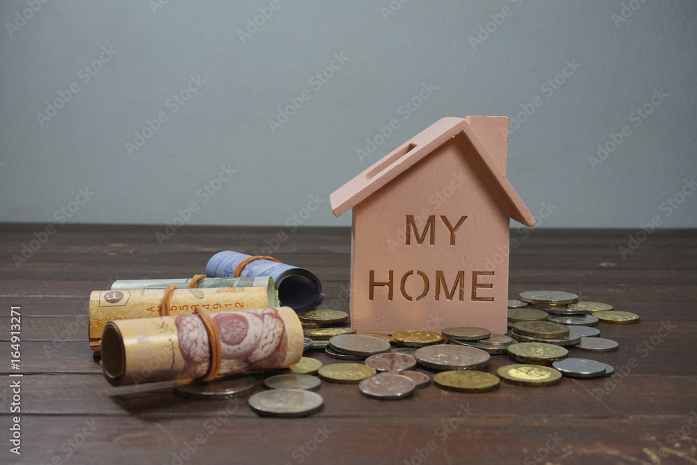 Malaysian Ringgit (MYR) coins and paper ringgit roll tied with a rubber ...