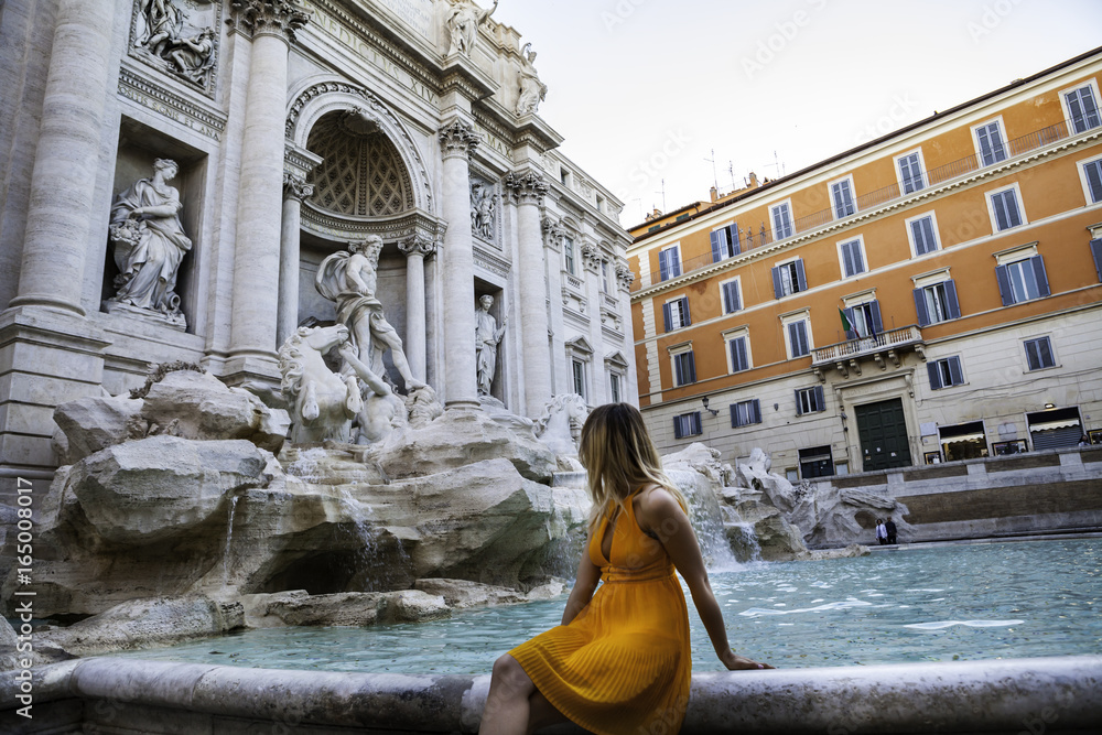 Girl in yellow dress in front of Trevi Fountain, Rome, Italy. Young ...