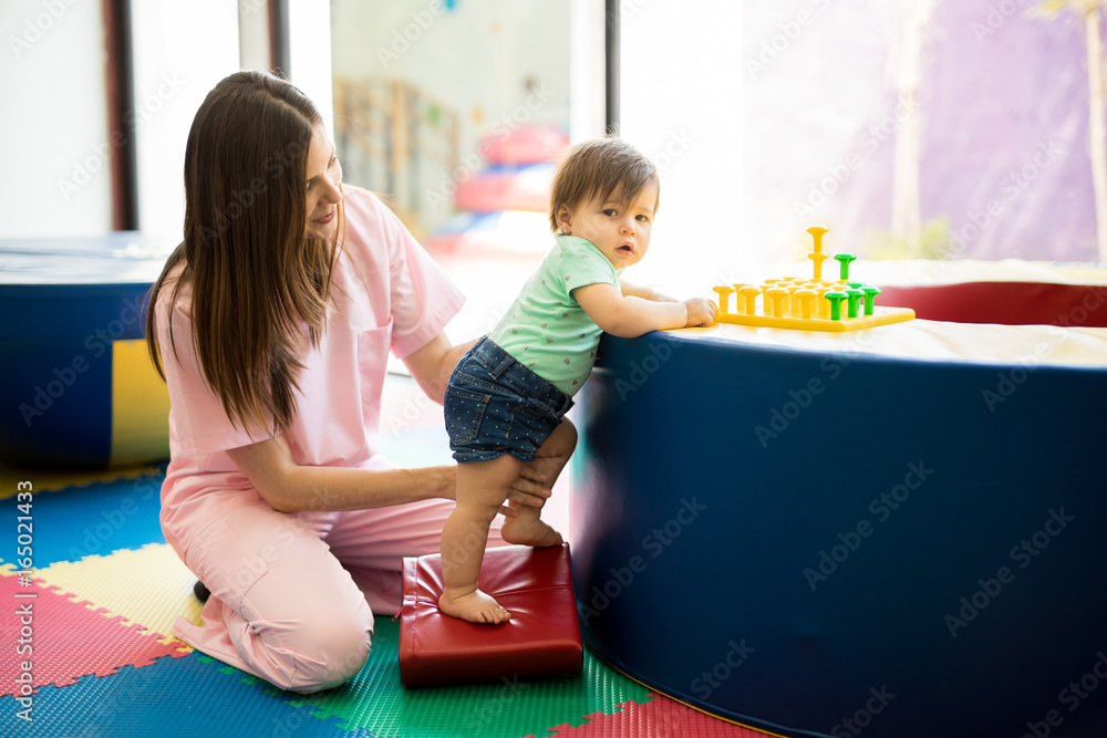 Baby maintaining balance Stock Photo | Adobe Stock