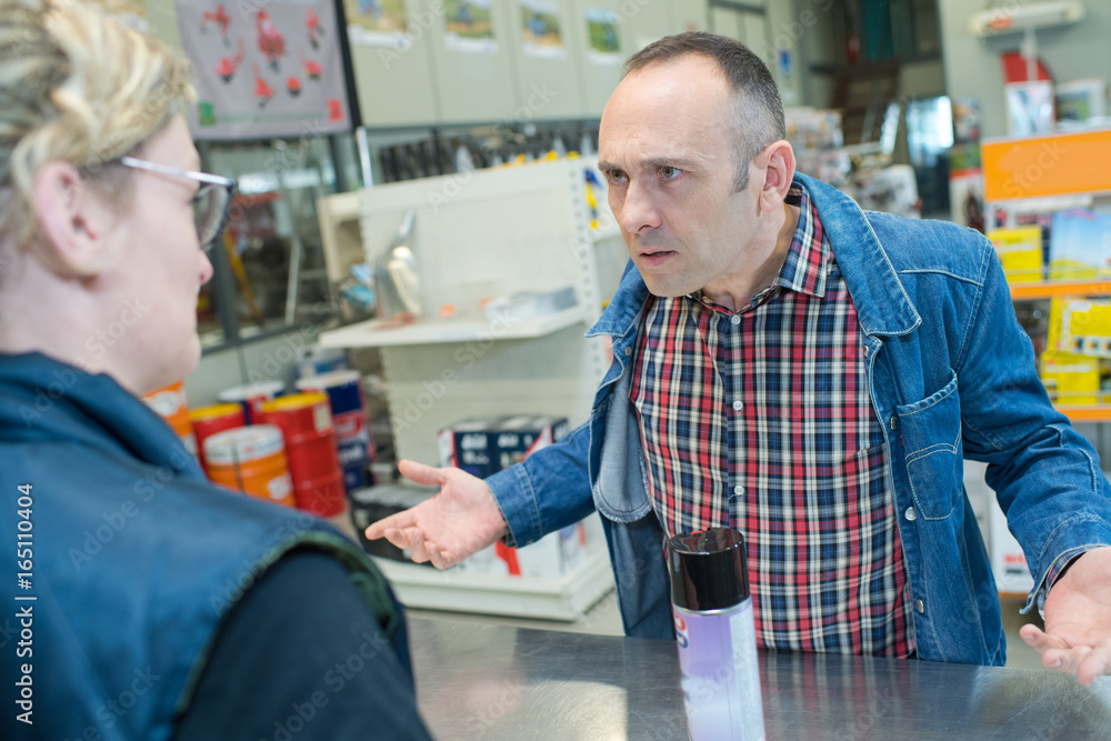 Aggressive customer at shop counter Stock Photo | Adobe Stock
