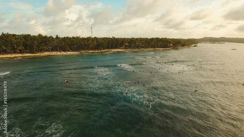 Surfers at siargao islands famous surf break cloud 9 near mindanao the ...