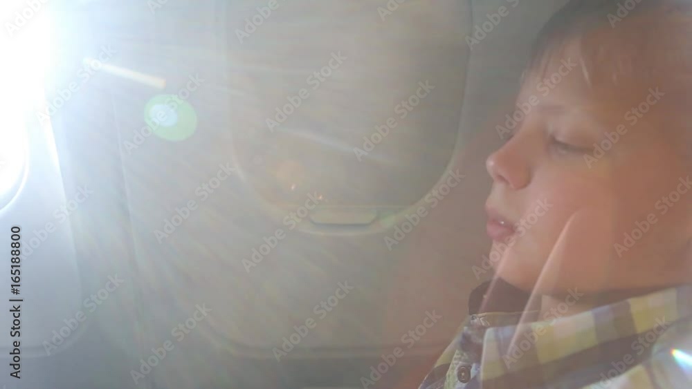 Closeup profile portrait of cute worried funny little kid during flight ...