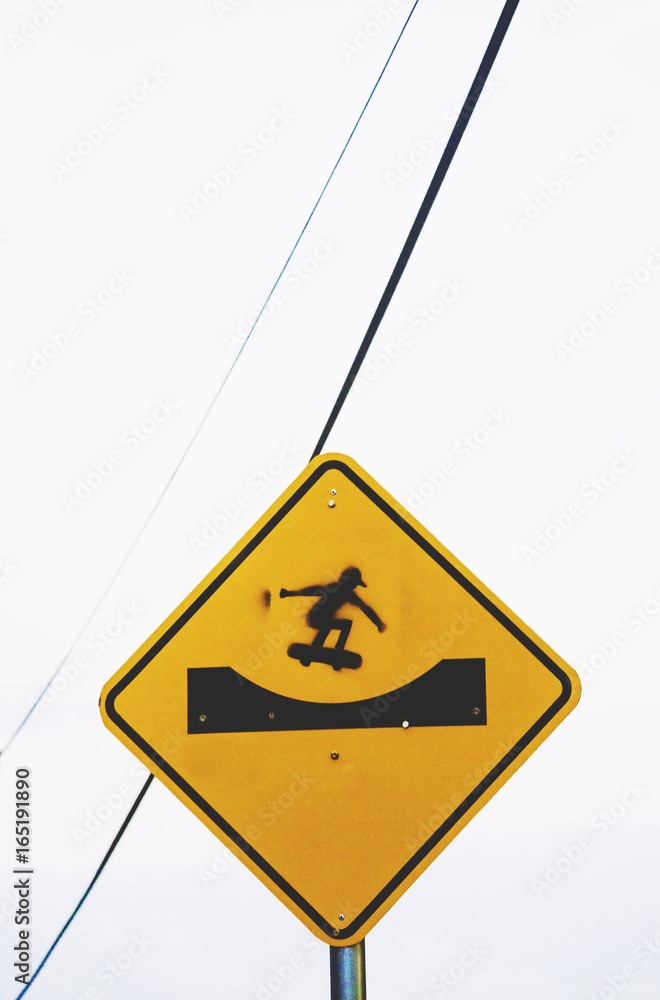 Uneven road traffic signal warning turned into fun stencil street art ...