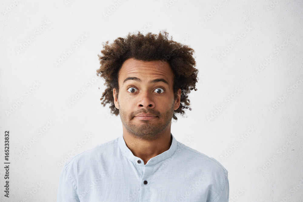 Human facial expressions and emotions. Portrait of funny bug-eyed young ...