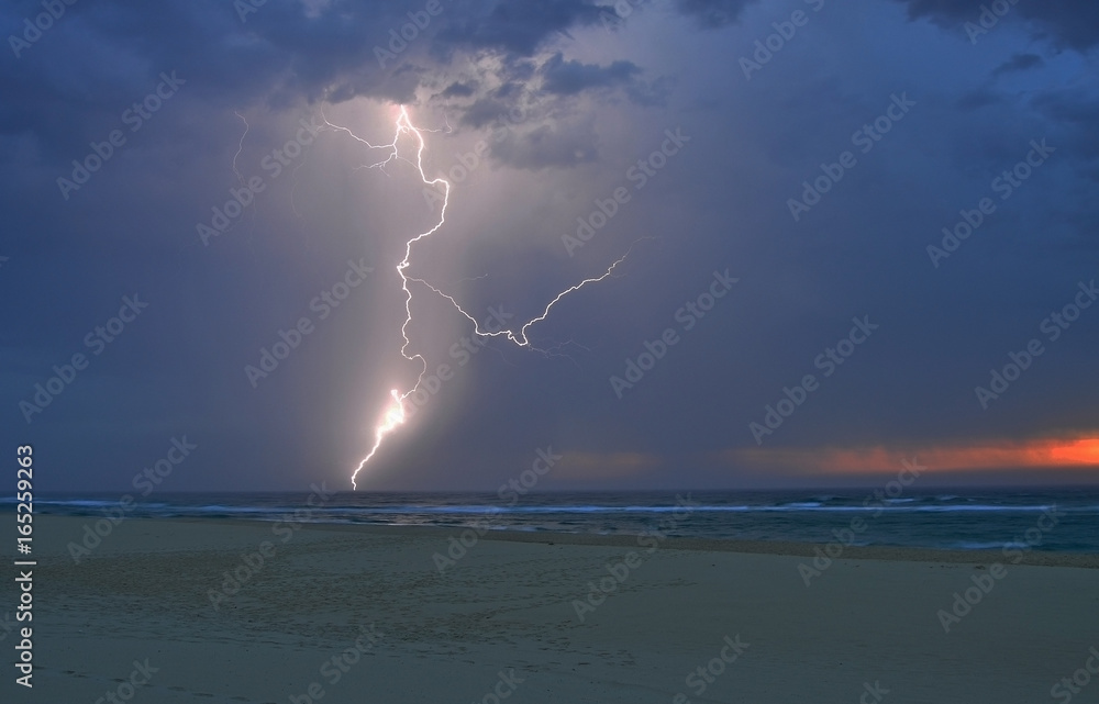 Weird shaped lightning strike over the Atlantic Ocean at sunset ...