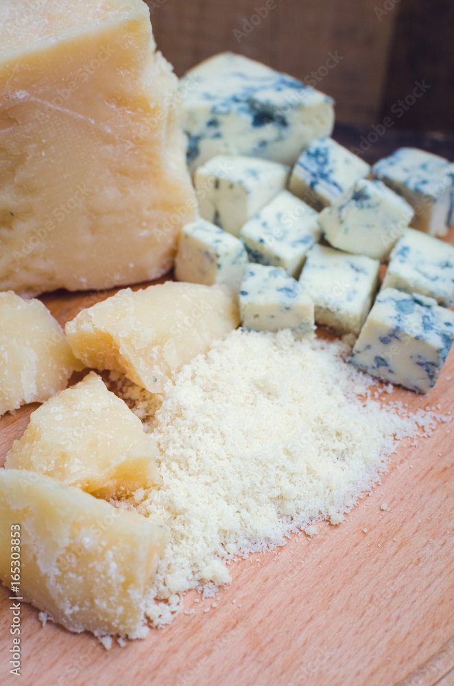 Grated Parmesan and sliced Blue cheese Stock Photo | Adobe Stock