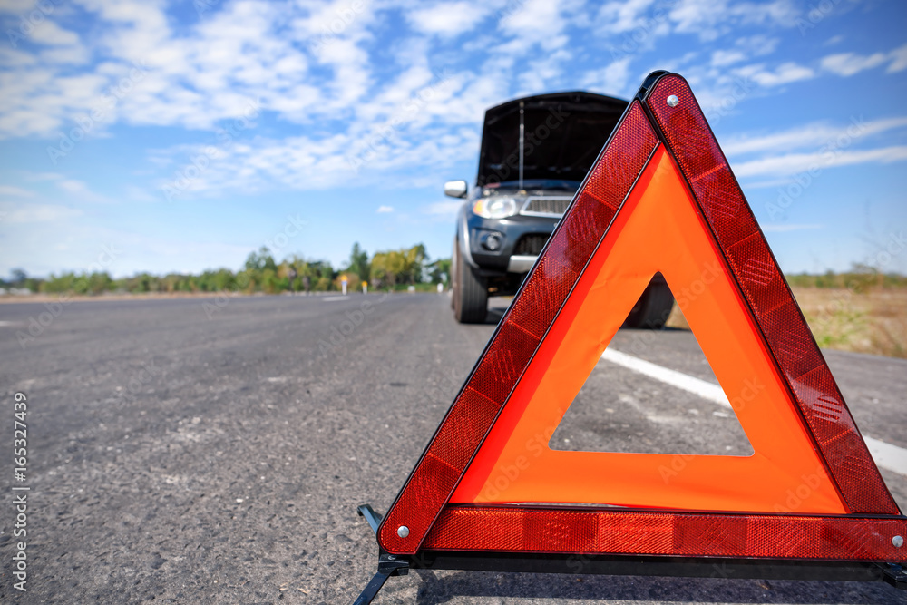 Red emergency stop sign and broken car on the road Stock Photo | Adobe ...