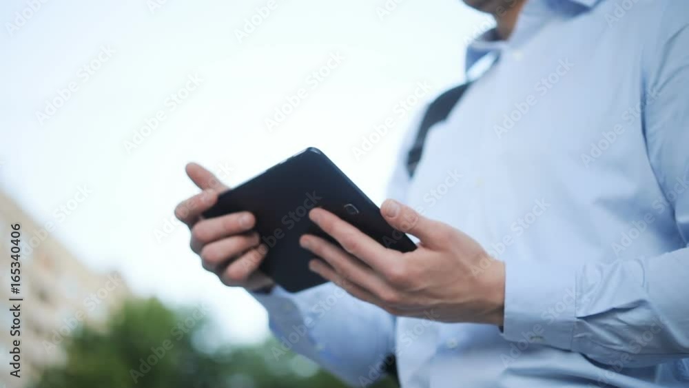 man hands holding moving tablet vertically horizontally turning black ...
