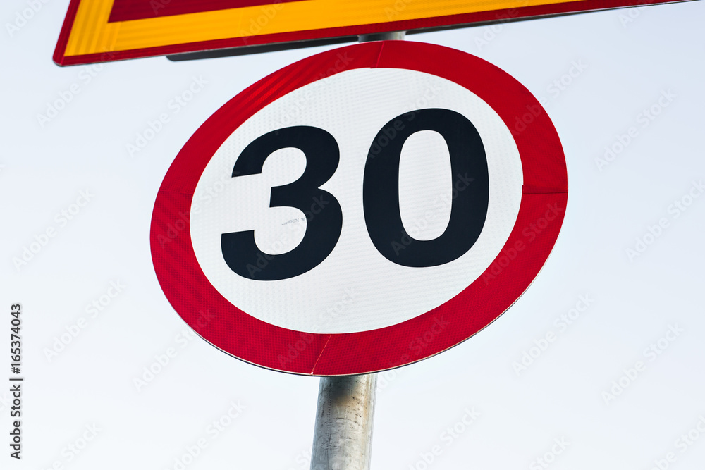 Road sign speed limit to 30 Stock Photo | Adobe Stock