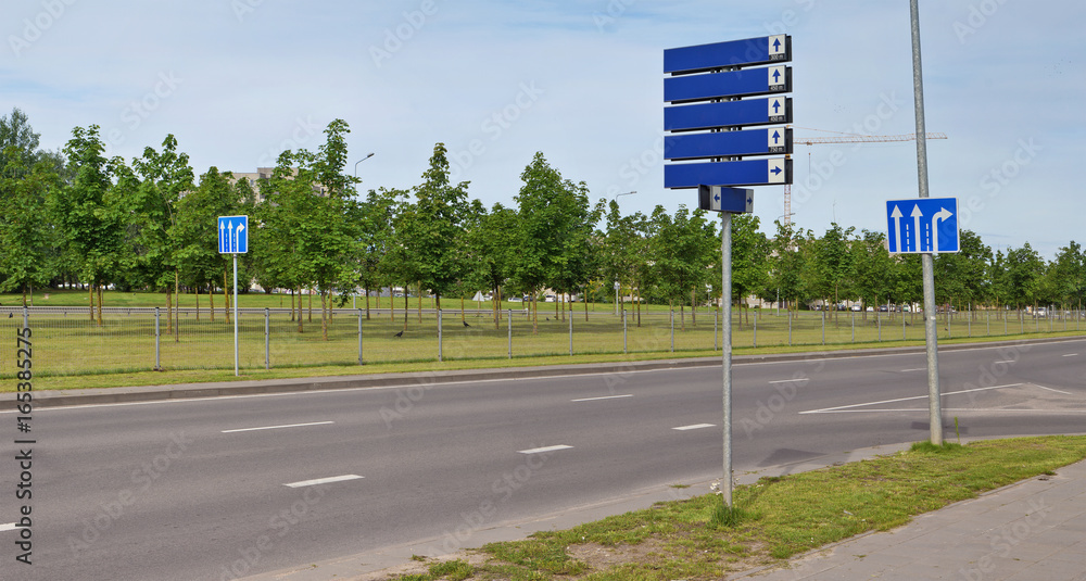 Blue light reflecting road signs with white arrows Stock Photo | Adobe ...