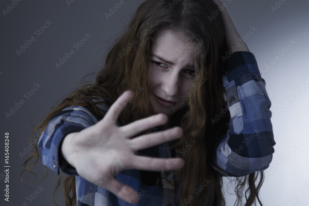 Sad woman scared putting hand in front of face (Gestures, body language ...