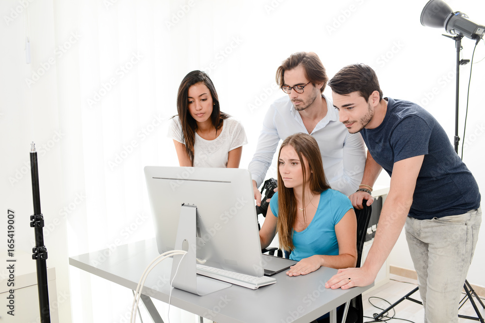 group of four photographer student learning creative portrait during ...