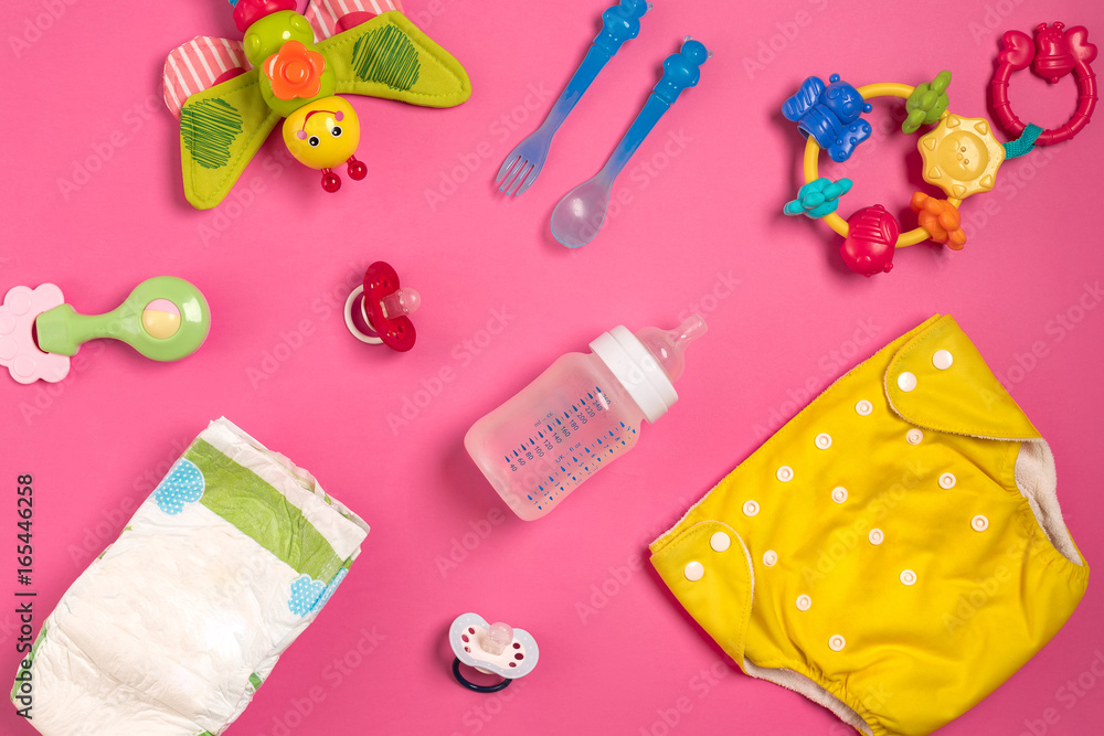 Baby care accessories and diapers on pink background. Top view Stock ...
