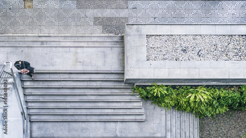 the top aerial view of people walk on the city pedestrian walkway with ...