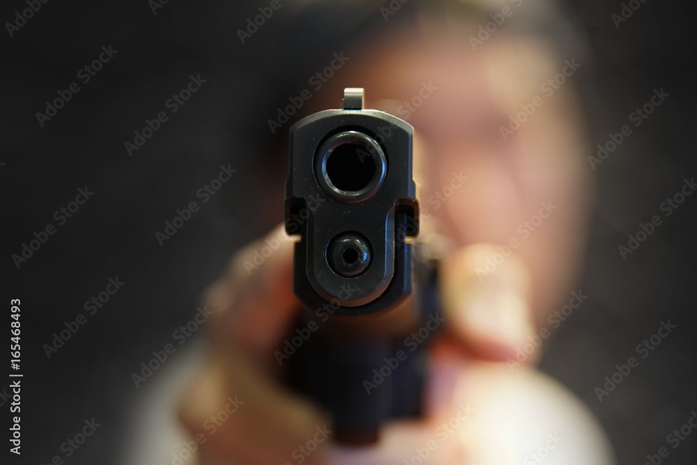 hand pointing a gun forward Stock Photo | Adobe Stock