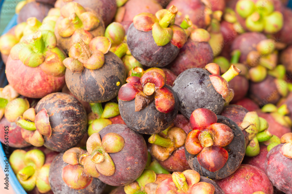 Purple mangosteen fruit at an Asian market Stock Photo | Adobe Stock