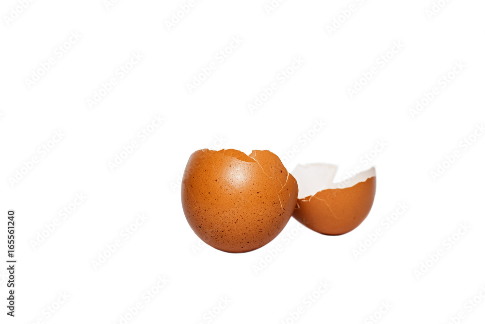 The egg shell is half broken on the white background. Stock Photo ...