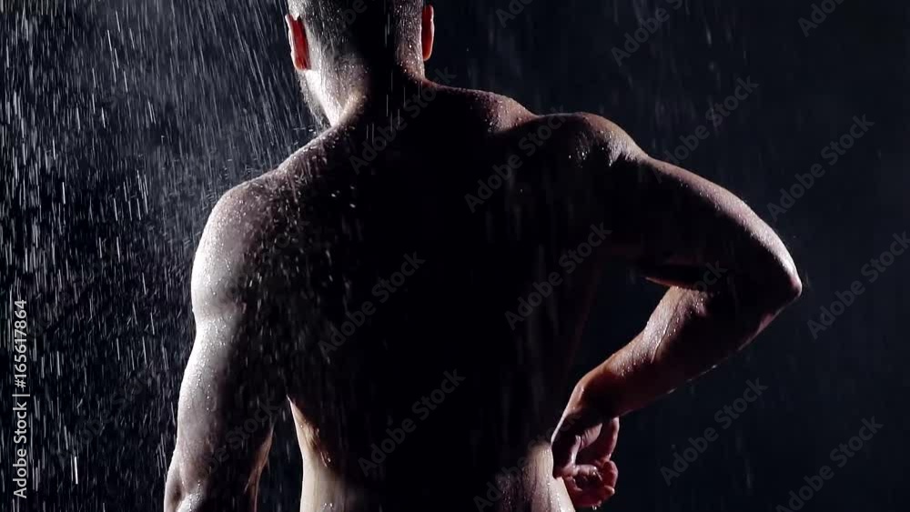 shooting from the back. posing big men athlete with the expansion of ...