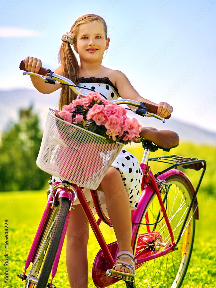 Bikes cycling girl. Child girl wearing white polka dots dress rides ...