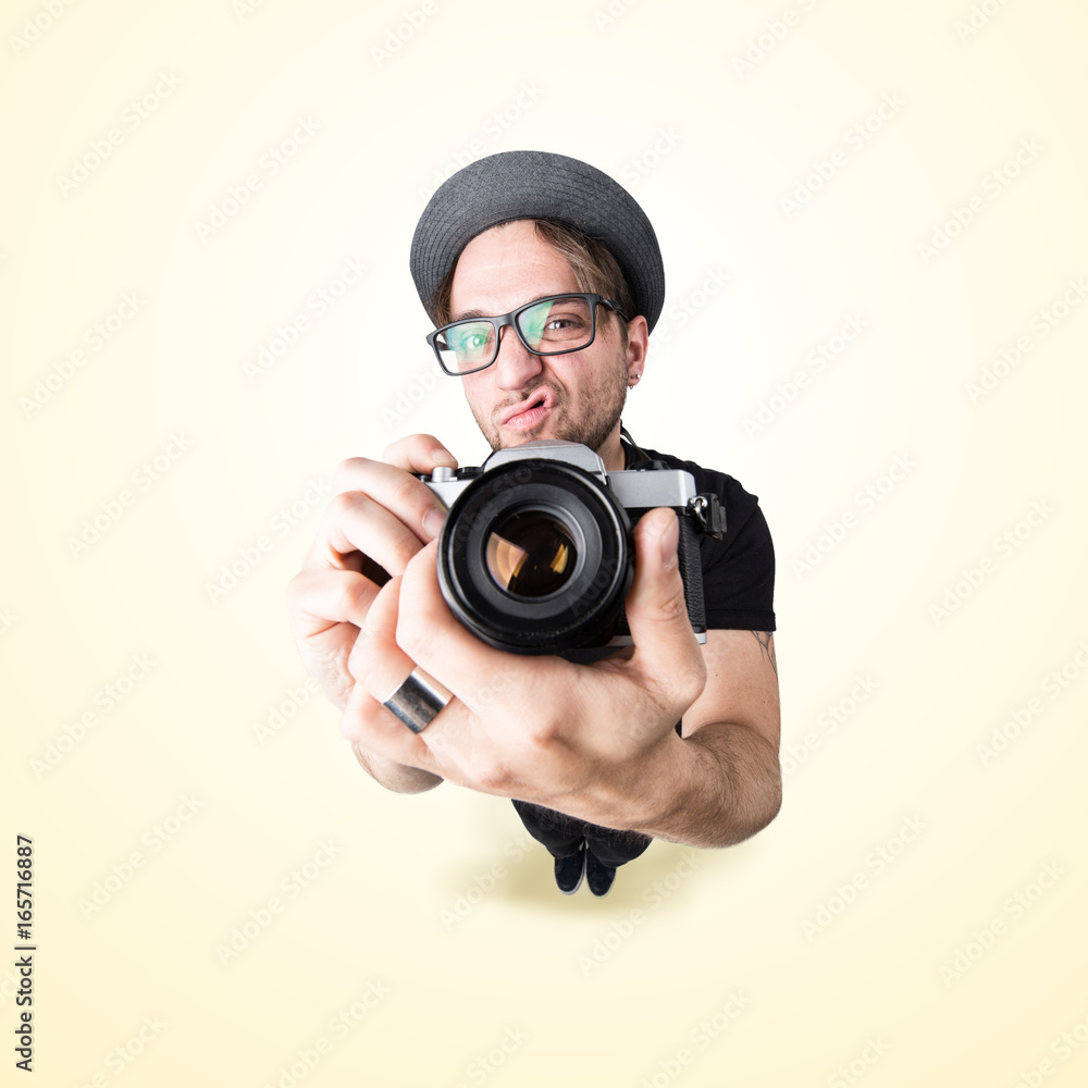 Funny man with a funny surprise expression shooting with his vintage ...