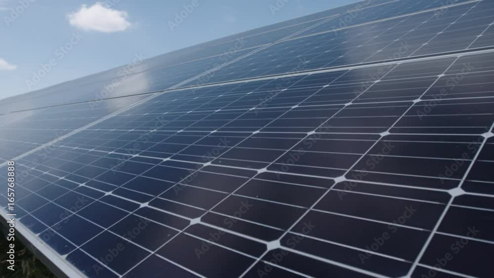 Slider (dolly) movement close up on a solar panel array generating ...