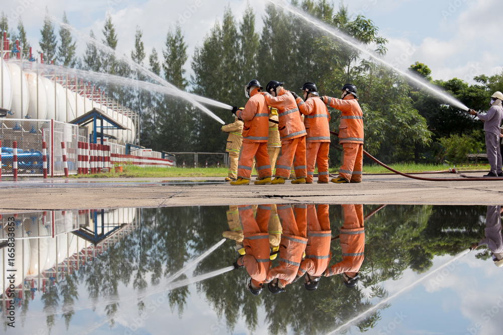 Firefighters spray water in LPG gas tanks, Fire extinguishers caused by ...
